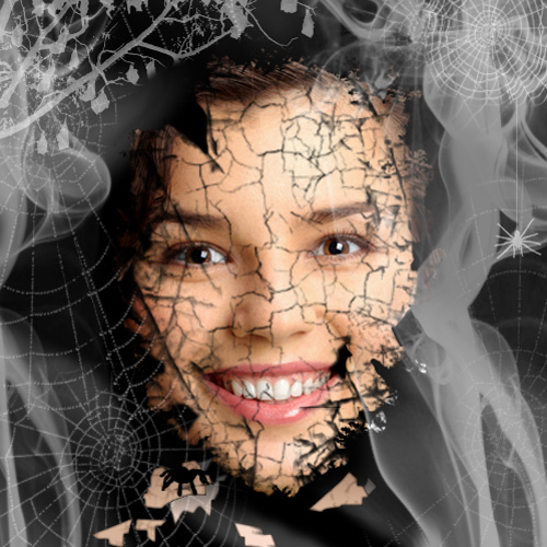 Scary face montage with splintered face and spider web